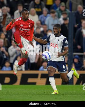Tottenham Hotspur's Kevin Danso (right) attempts to control the ball ...
