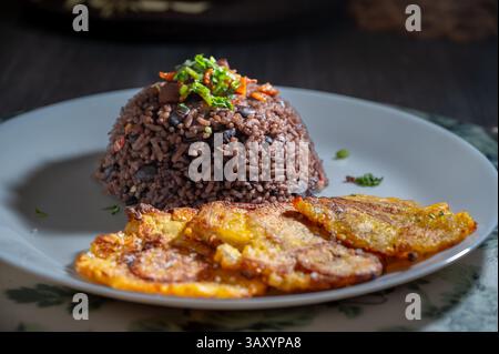 Rice Congri and Plantain Tostones, Delicious Cuban Food Stock Photo - Alamy
