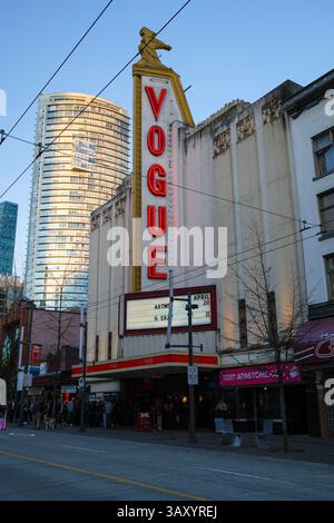 Vertical marquee sign on historic theater building against blue sky ...