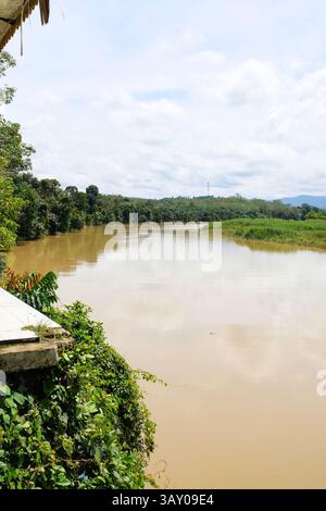 Landscape of Kampar River with hills and forest on its banks is ...