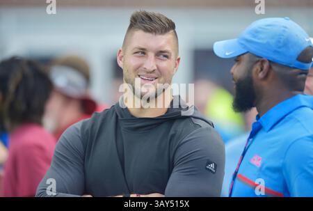 SEC Nation host Tim Tebow listens to his co-hosts during the SEC Nation ...
