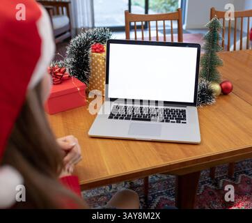 laptop with gift box and christmas lights background Stock Photo - Alamy