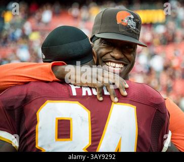 Former NFL quarterback Robert Griffin III, front left, greets his team ...