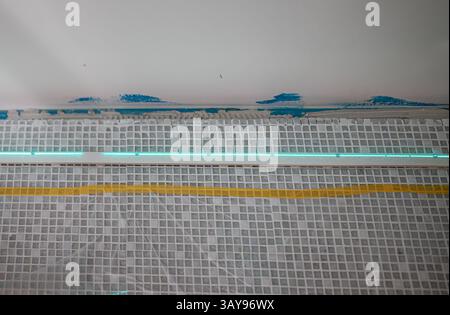 Laser-Guided Ceiling Installation in Progress in Bathroom Stock Photo ...