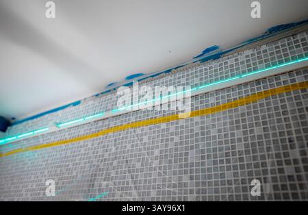Laser-Guided Ceiling Installation in Progress in Bathroom Stock Photo ...