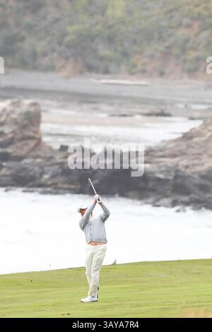 Graeme McDowell of Northern Ireland hits out of the rough on the 1st ...