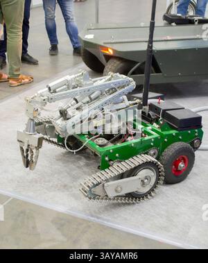 Small robot car unmanned with a crane and on tracks. Robotization ...