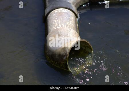 open pipe with water flowing out Stock Photo - Alamy