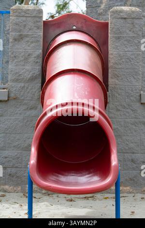 red slide at kids playground Stock Photo - Alamy