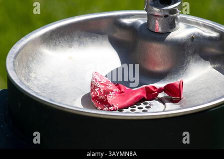 pink balloon plastic deflated remnants Stock Photo - Alamy