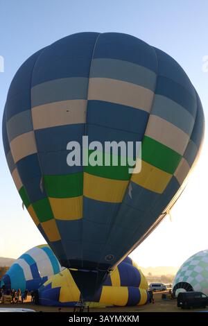 Hot air balloon teams wait for launch at the balloon festival in Osaki ...