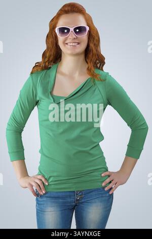 Happy excited brown-haired girl raking pile of won chips at poker table ...