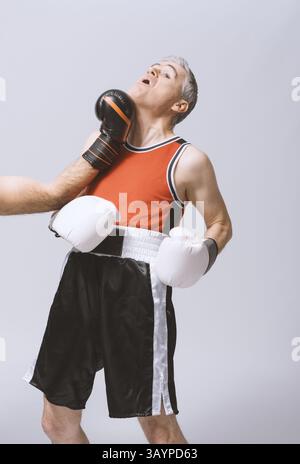 Funny boxer getting punched on his face during a boxing match Stock ...