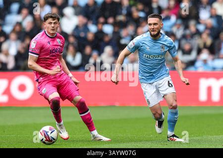 Coventry City's Matt Grimes (right) and Swansea City's Ethan Galbraith ...