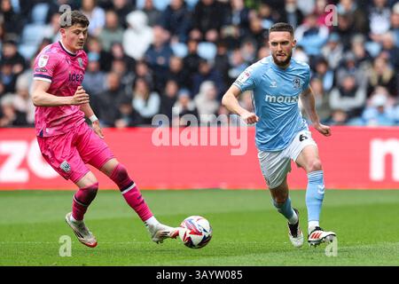 Coventry City's Matt Grimes (right) and Swansea City's Ethan Galbraith ...