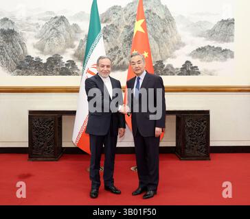 Iranian Foreign Minister Abbas Araghchi, center, and Iranian Ambassador ...