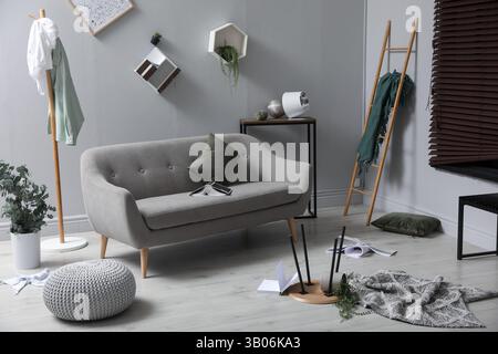 Chaotic living room interior after strong earthquake Stock Photo - Alamy
