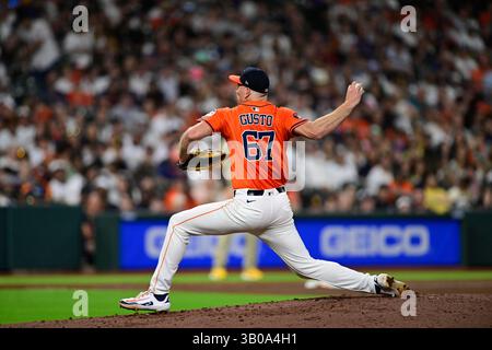 Houston Astros starting pitcher Ryan Gusto throws against the ...