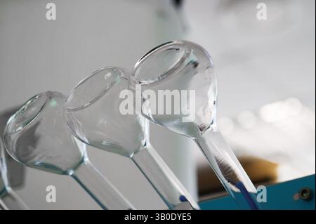 Clean glass laboratory equipment arranged neatly on a lab bench in a ...