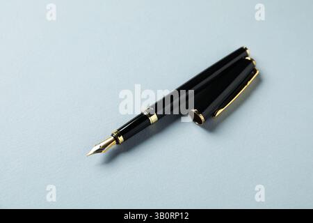 One stylish pen and lid on grey background, top view Stock Photo - Alamy