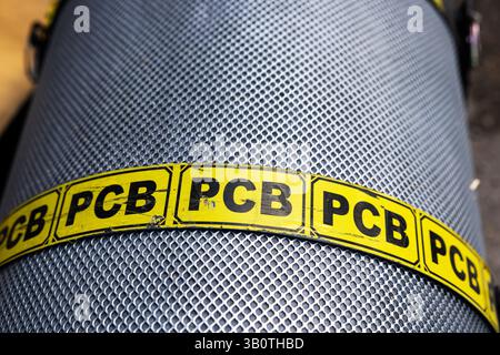 A construction site, sign stating that PCB decontaminate is in progress ...