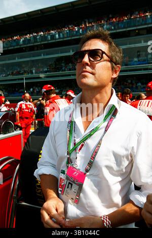 Hugh Grant on the grid before the British Grand Prix at Silverstone ...