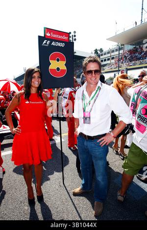 Hugh Grant on the grid before the British Grand Prix at Silverstone ...