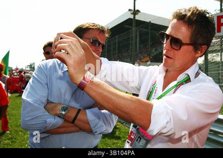 Hugh Grant on the grid before the British Grand Prix at Silverstone ...