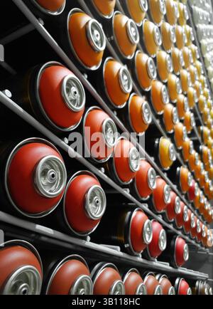 red spray paint on a yellow colored paper background Stock Photo - Alamy