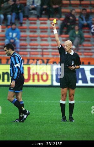 Milan Italy, 1995, Referee Pierluigi Collina gives the footballer ...