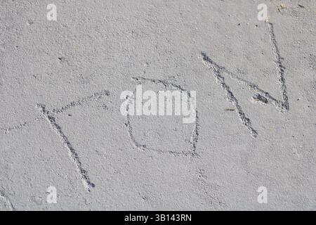 letters carved into pavement cement Stock Photo - Alamy