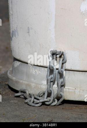 heavy chain attached to container Stock Photo - Alamy