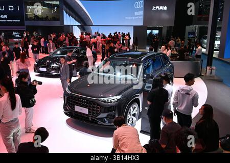 Visitors visited a model displayed at the Audi booth at the 2025 ...
