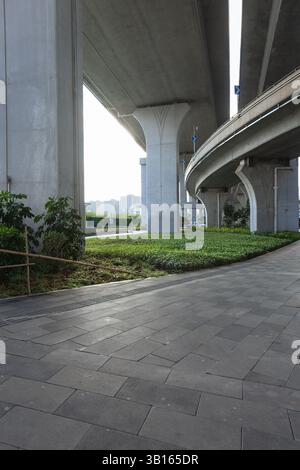 Diminishing perspective view of empty overpass with protection mesh ...