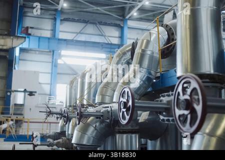 equipment at the gas compressor station. Turbines and pipe gate valves ...