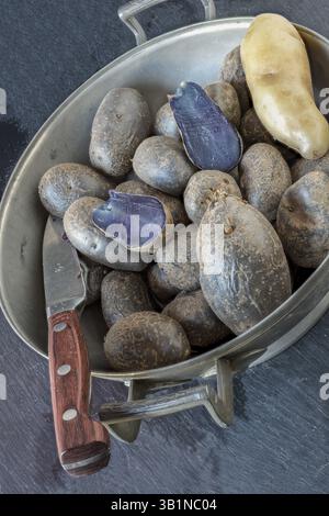 Boiled potatoes, Violet Queen variety Stock Photo - Alamy