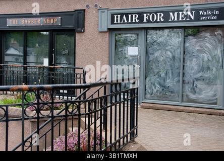Two gents barber shops next to each other on high street Stock Photo ...
