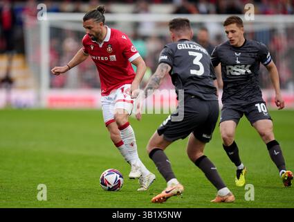 Wrexham's Jay Rodriguez (centre right) is tackled by Preston North End ...