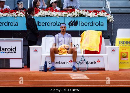 Alex de Minaur of Australia sits during a break in play of his semi ...