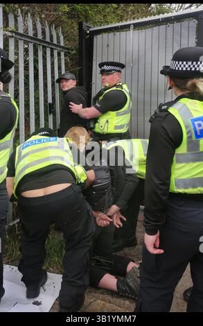 Huntingdon, UK. 26 APR, 2025. Lady holds "Stop testing on us" sign ...