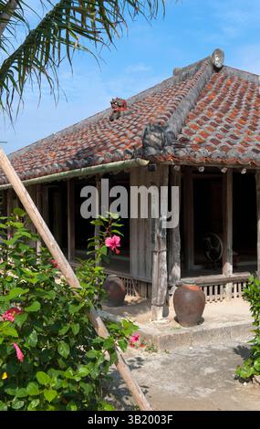 Traditional Okinawan historical residence with ceramic roof tiles and ...