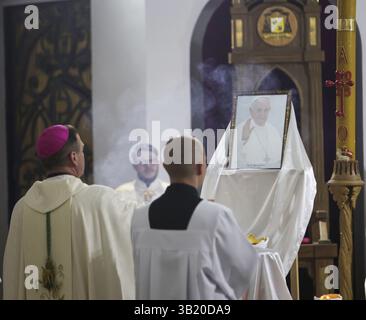 Non Exclusive: Priests conduct the holy mass in memory of late Pope ...