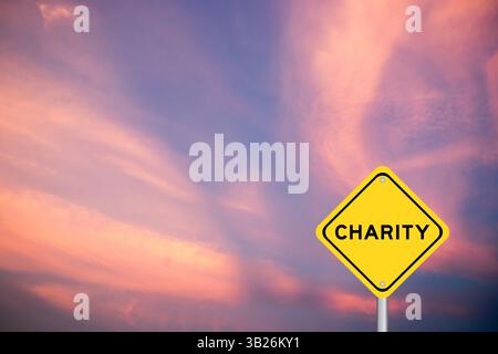 Yellow transportation sign with word donate on violet sky background ...