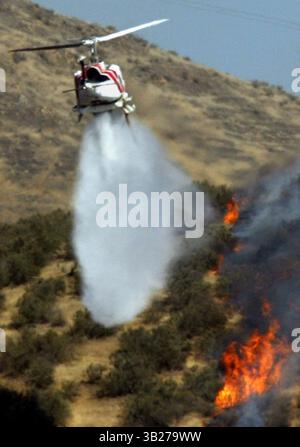 Helicopters drop water on a fire burning in Creightons Creek Stock ...