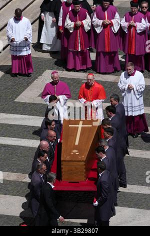 The coffin of Pope Francis is carried in front of dignitaries ...