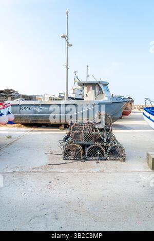 Stack of Lobster pot traps between boats Stock Photo - Alamy