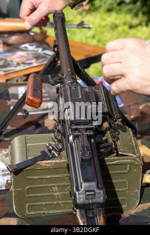 Soviet-made PK machine gun and camouflage netting.. "Kalashnikov's ...