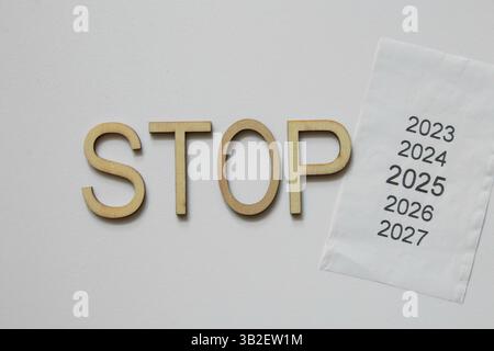 word STOP made of wooden letters on red background with copy space ...