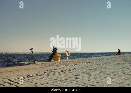 People relaxing on the Nea Paralia - Seaside Promenade in Thessaloniki ...