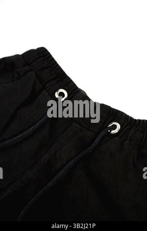 A sleek black outfit featuring a stylish jacket and trendy cargo pants ...